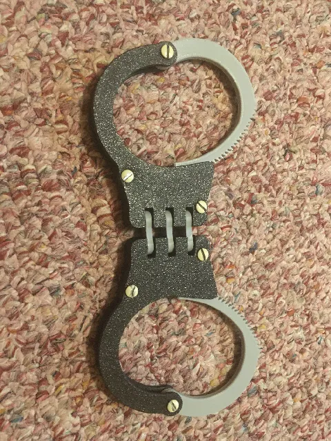 Make of Triple hinge handcuffs by Hudson Printing Industries | Download ...
