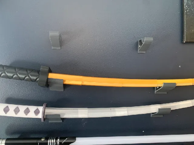 Wall mount hanger for 3-D printed swords w/ built in screw holes by ...