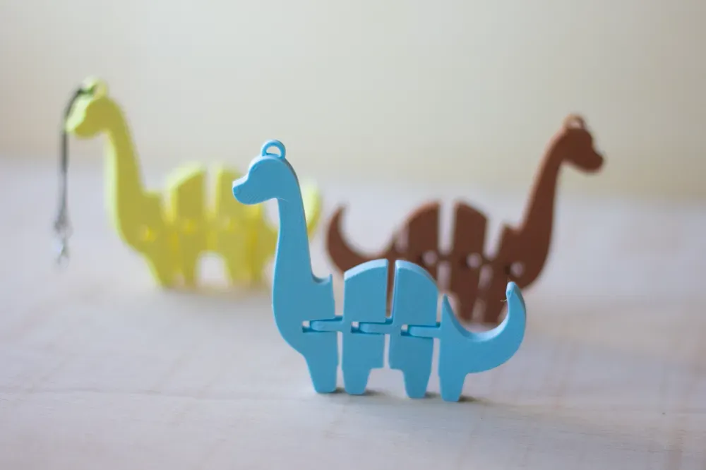 Flexi Dino Keychain Articulated by HekMaker | Download free STL model ...