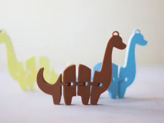 Flexi Dino Keychain Articulated by HekMaker | Download free STL model ...