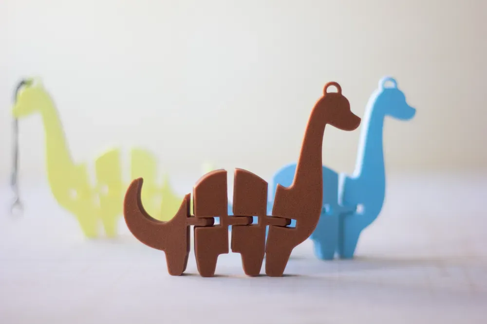 Flexi Dino Keychain Articulated by HekMaker | Download free STL model ...