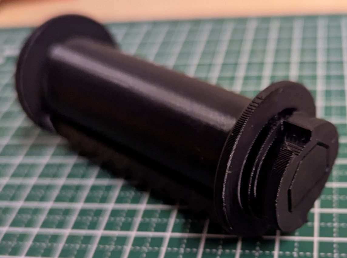 Finally insert it into the spool holder mount on the printer and rotate it until it clicks into ...