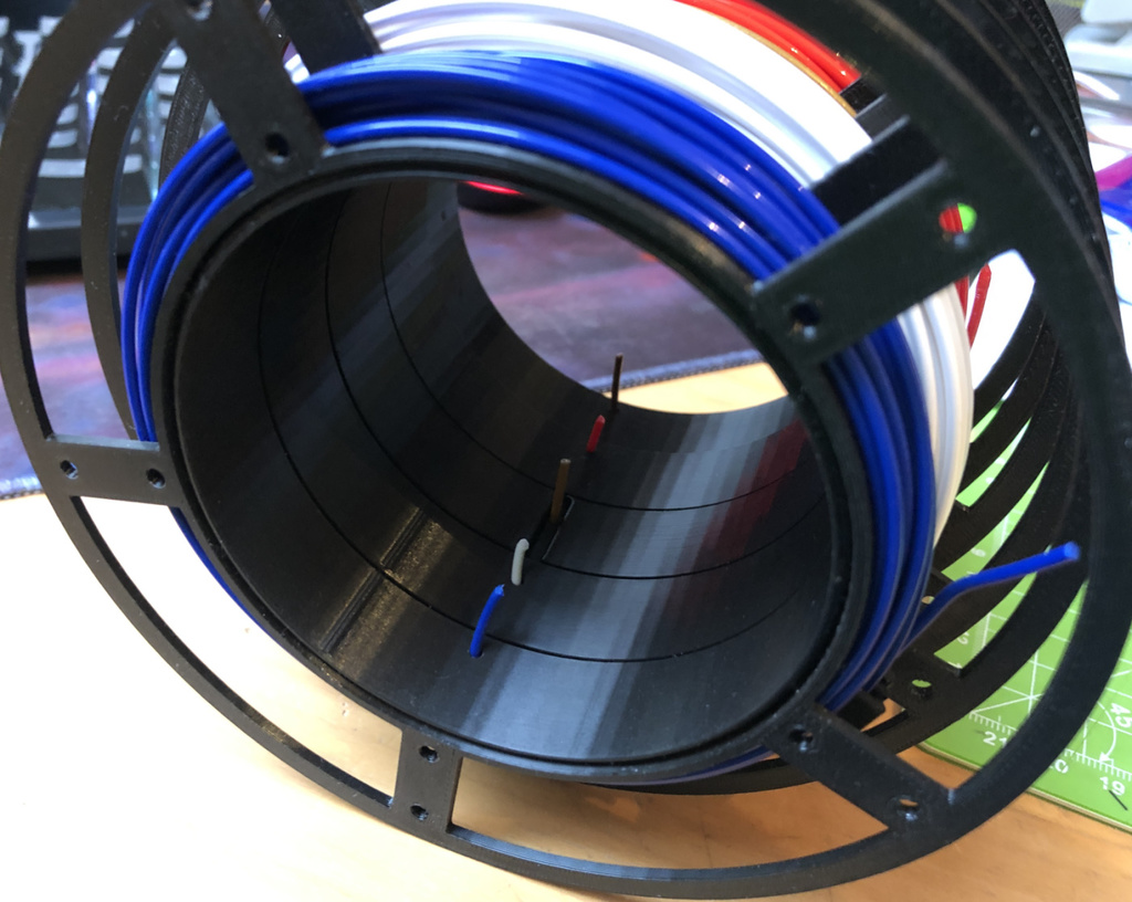 expandable loose filament spool with holes for skate/bearing/roller ...
