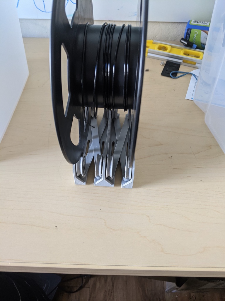 Adjustable multi-spool TUSH-style spool holder with a scissor mechanism ...
