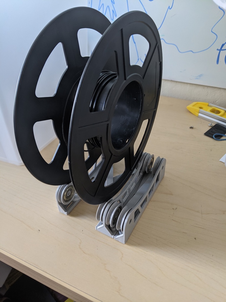 Adjustable multi-spool TUSH-style spool holder with a scissor mechanism ...