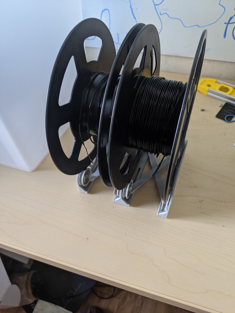 Adjustable multi-spool TUSH-style spool holder with a scissor mechanism ...
