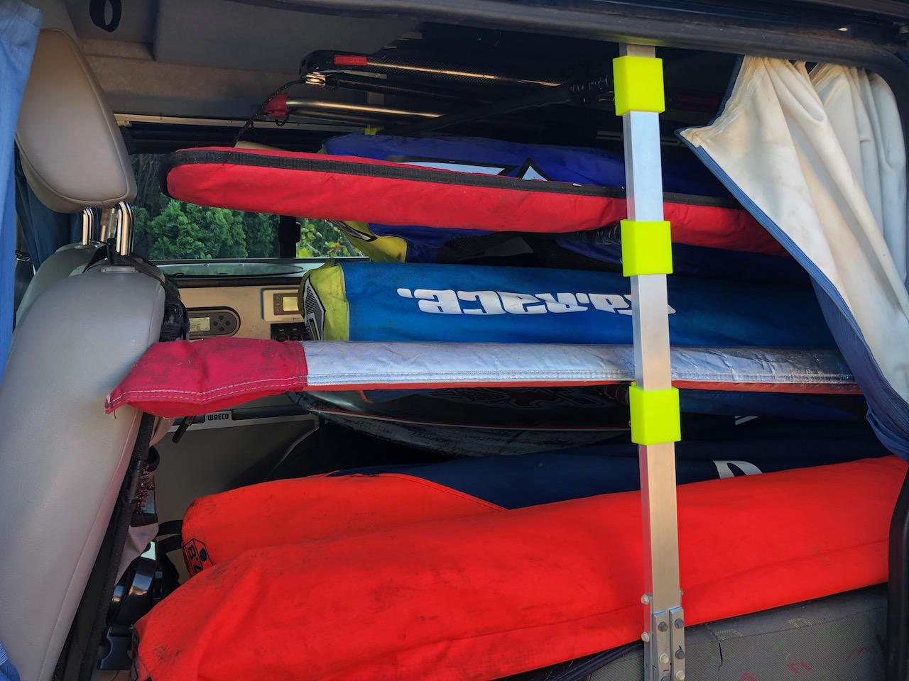 Fully adjustable, quickly removable, low profile van rack for ...