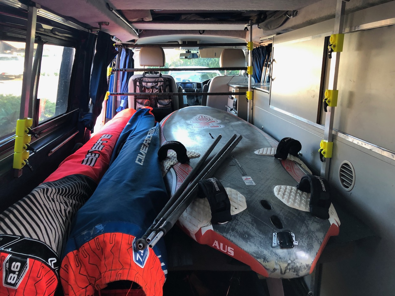 Fully adjustable, quickly removable, low profile van rack for ...