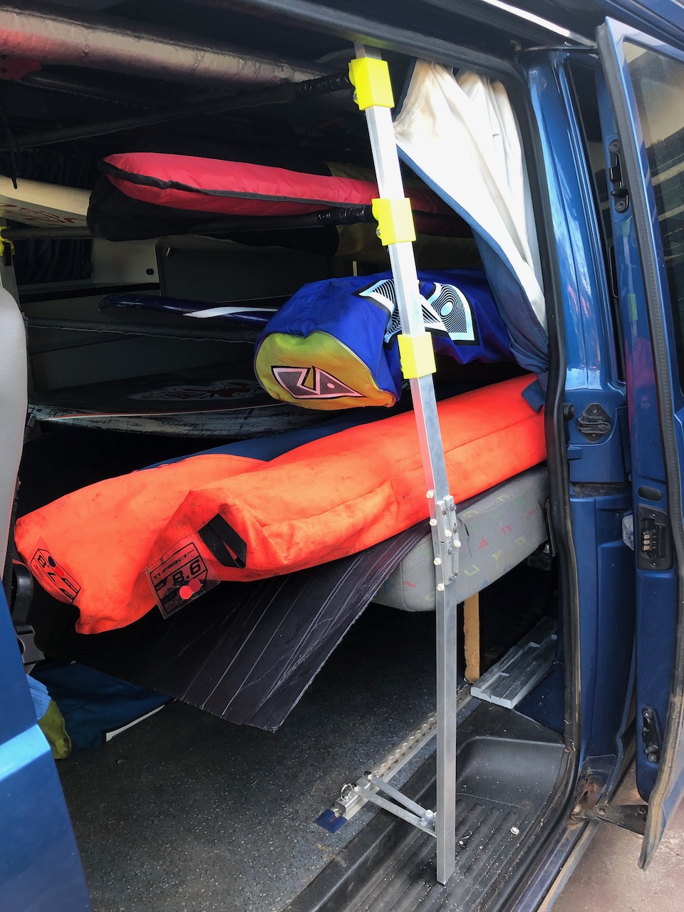 Fully adjustable, quickly removable, low profile van rack for ...