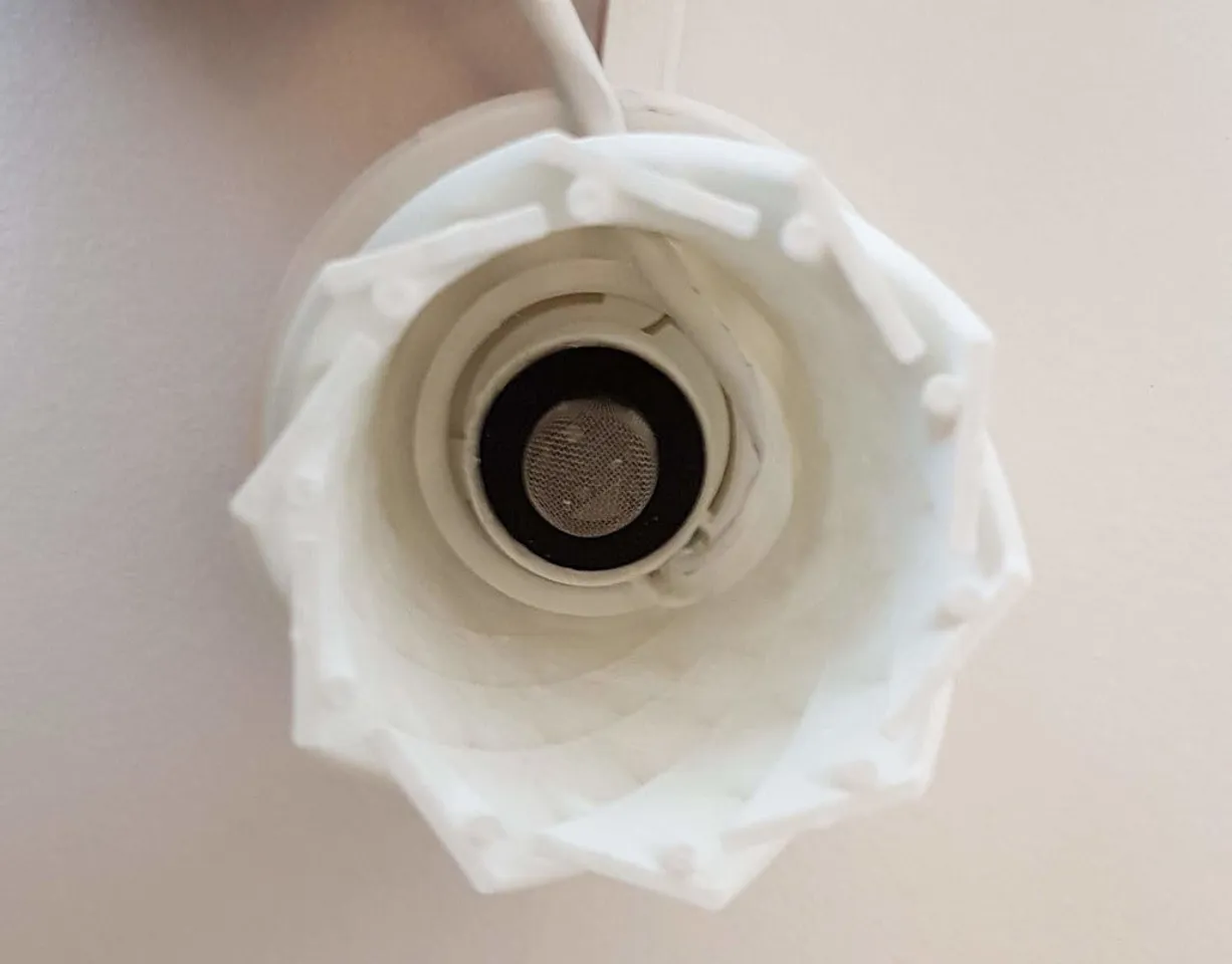 Helical rain/radiation shield for weather sensors with sensor mounting ...