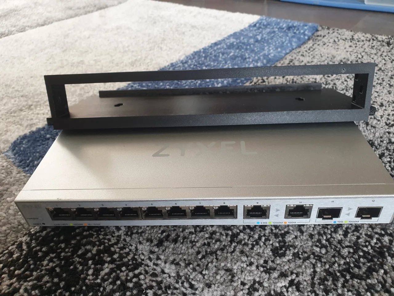Rack ear for Zyxel XGS1210-12 switch by Vaarlion | Download free STL ...