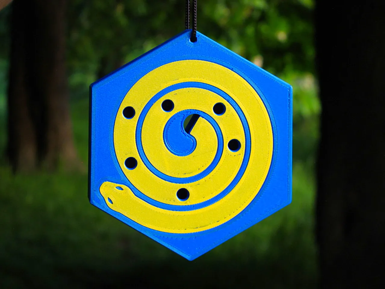 Low tone pocket snake flute rolled into the hexagonal shape by Maclab ...