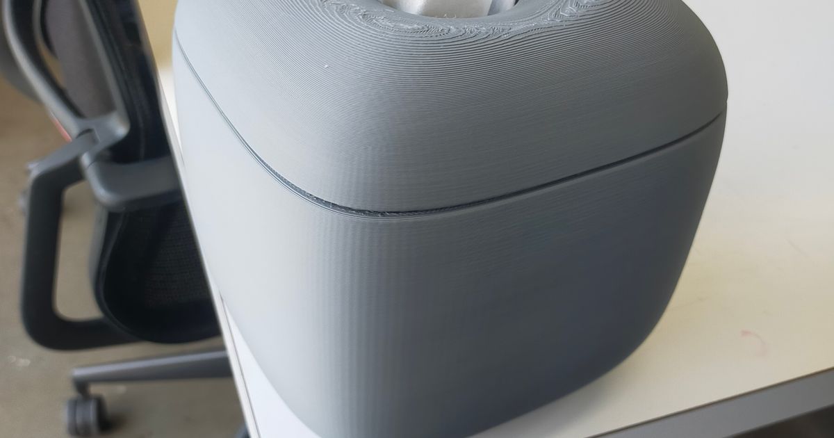 A tissue box that has a shape resembling a combination of a sphere and ...