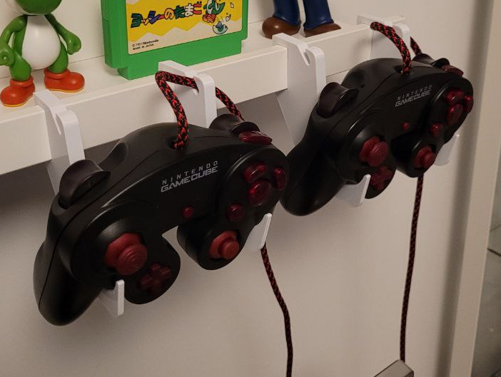 Gamecube controller (and others) supports for IKEA MOSSLANDA shelf by ...