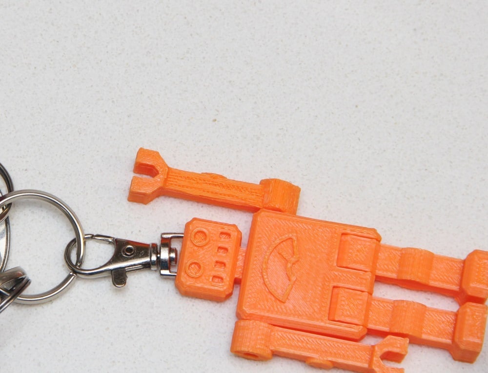 One piece articulated robot keychain with a clip by Nir Dobovizki ...