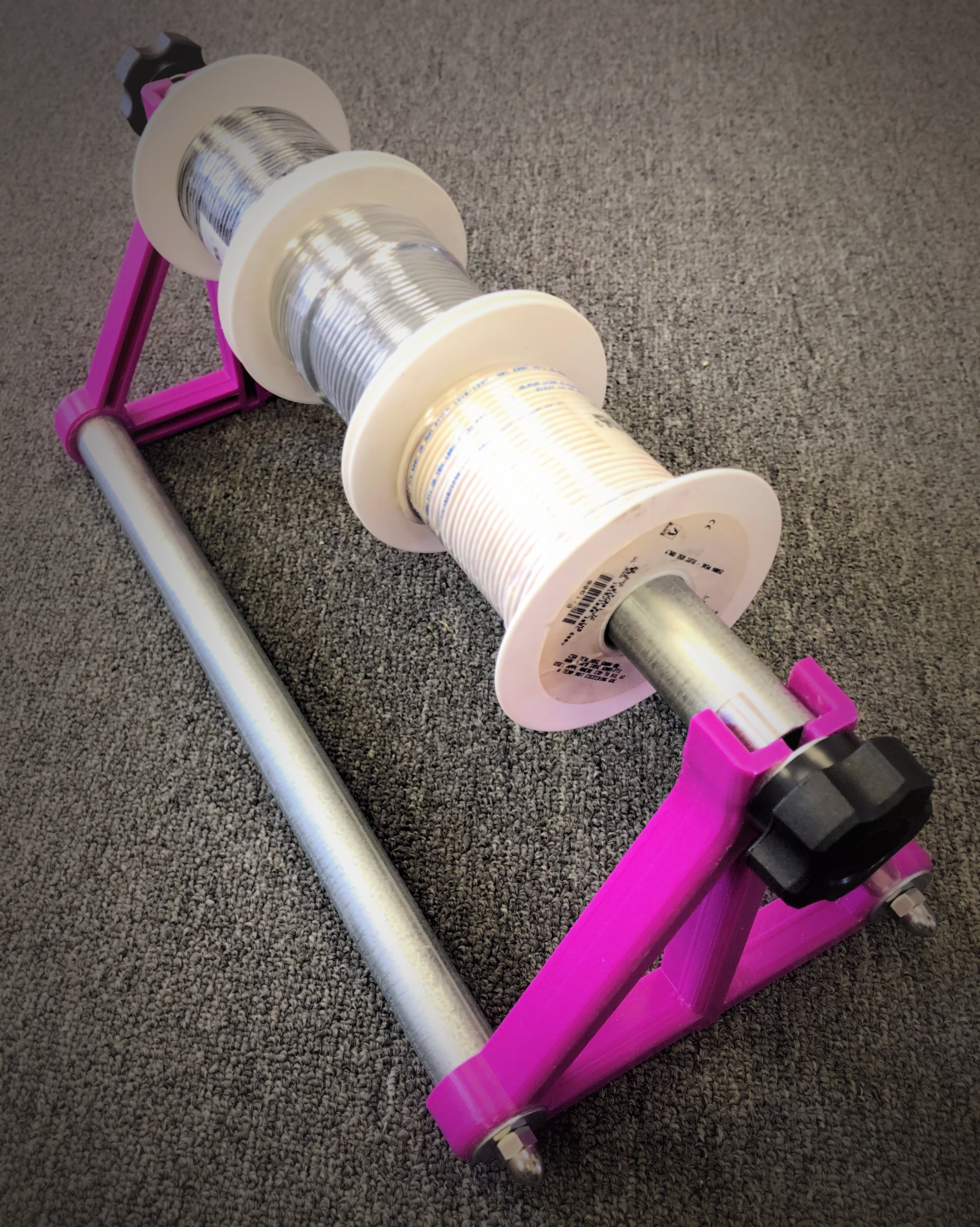 Stand to hold a 10Kg roll of heat/vacuum-seal bag material and/or ...