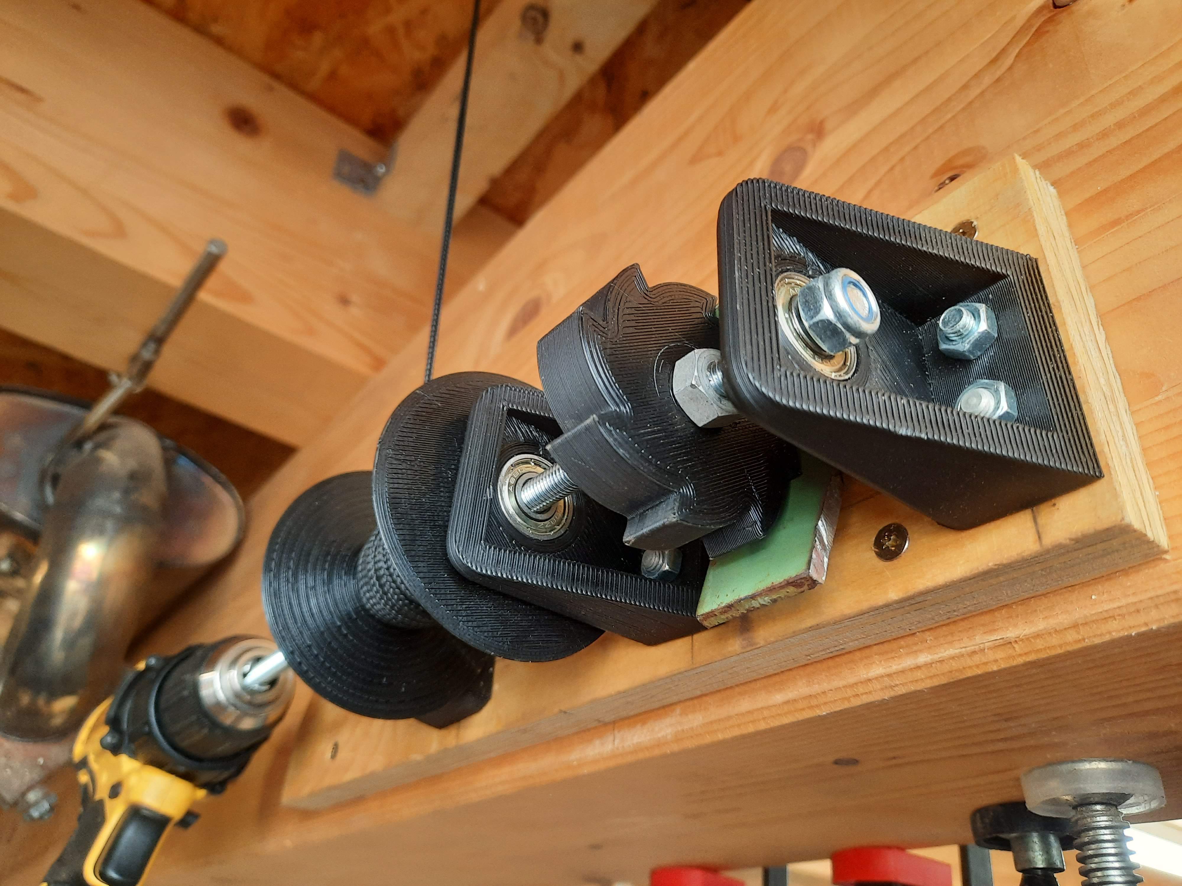 Pulley system with drill powered winch (sort of ^^) -> ceiling storage ...