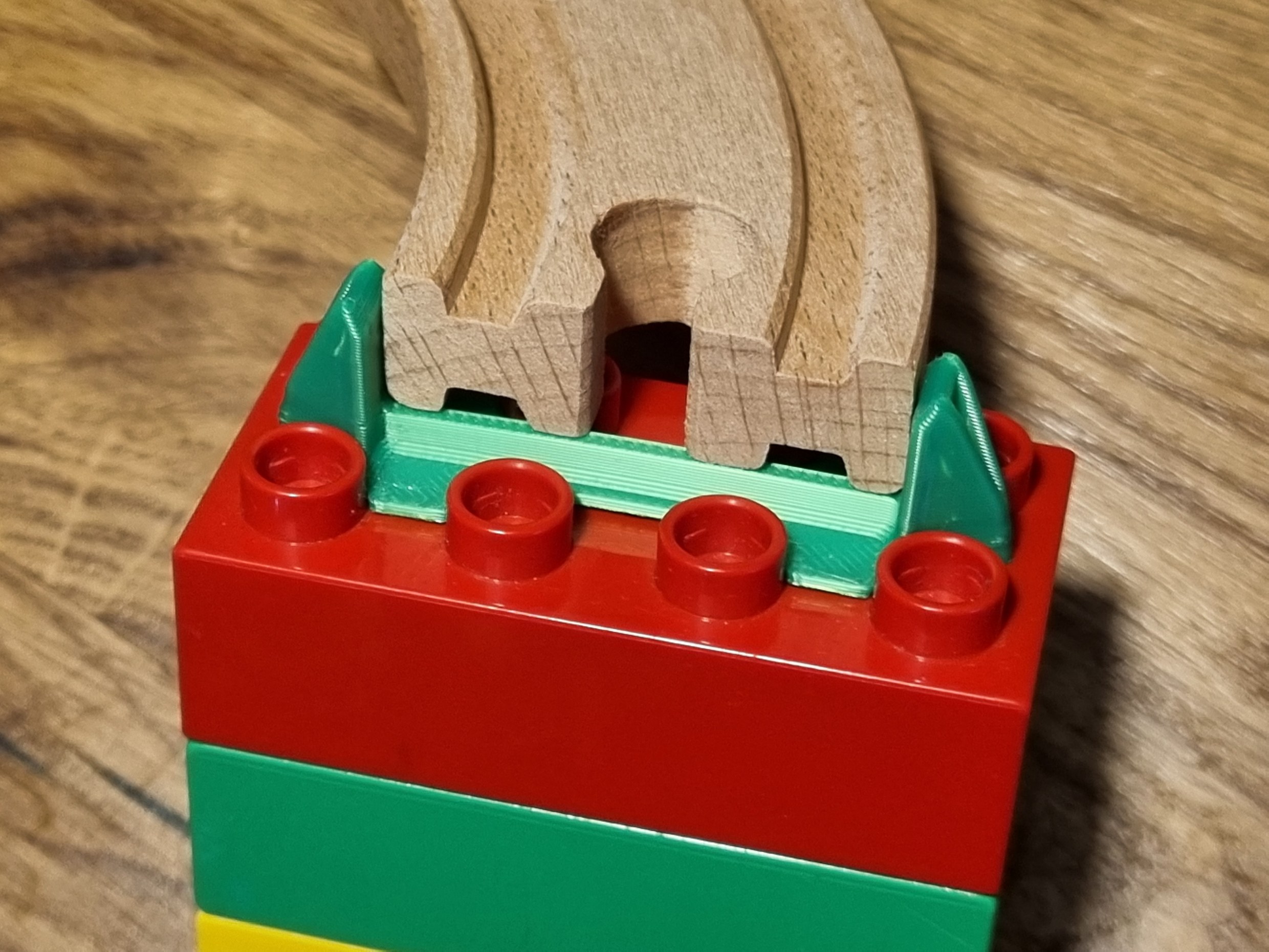 minimalist adapter between Duplo bricks and wodden model train tracks ...