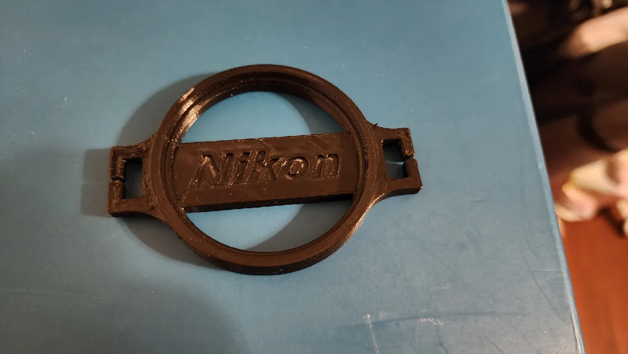 Nikon Lens Cap Clip by George | Download free STL model | Printables.com