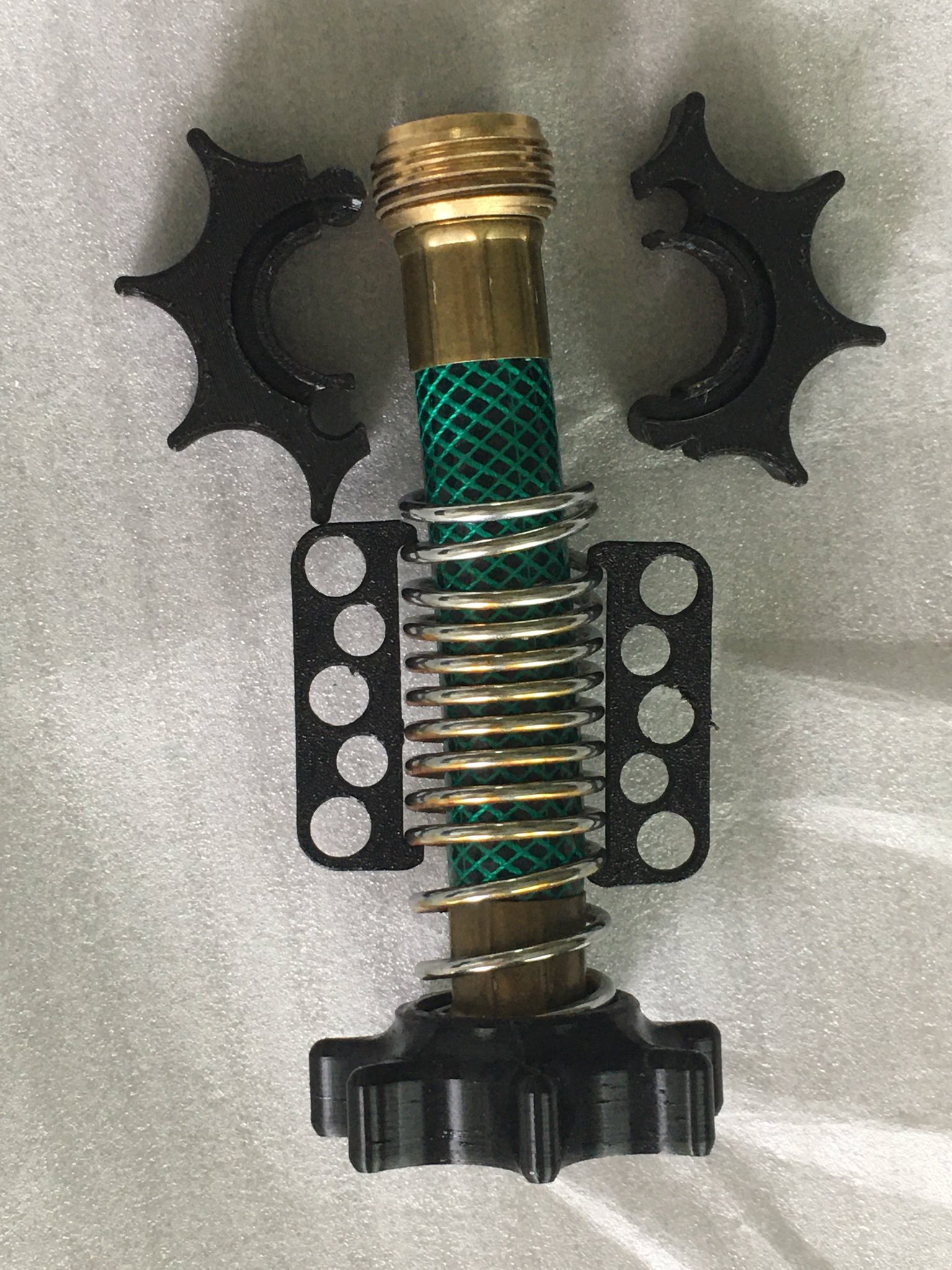 Solid Coil Spring compressor for installation of garden hose handle on ...