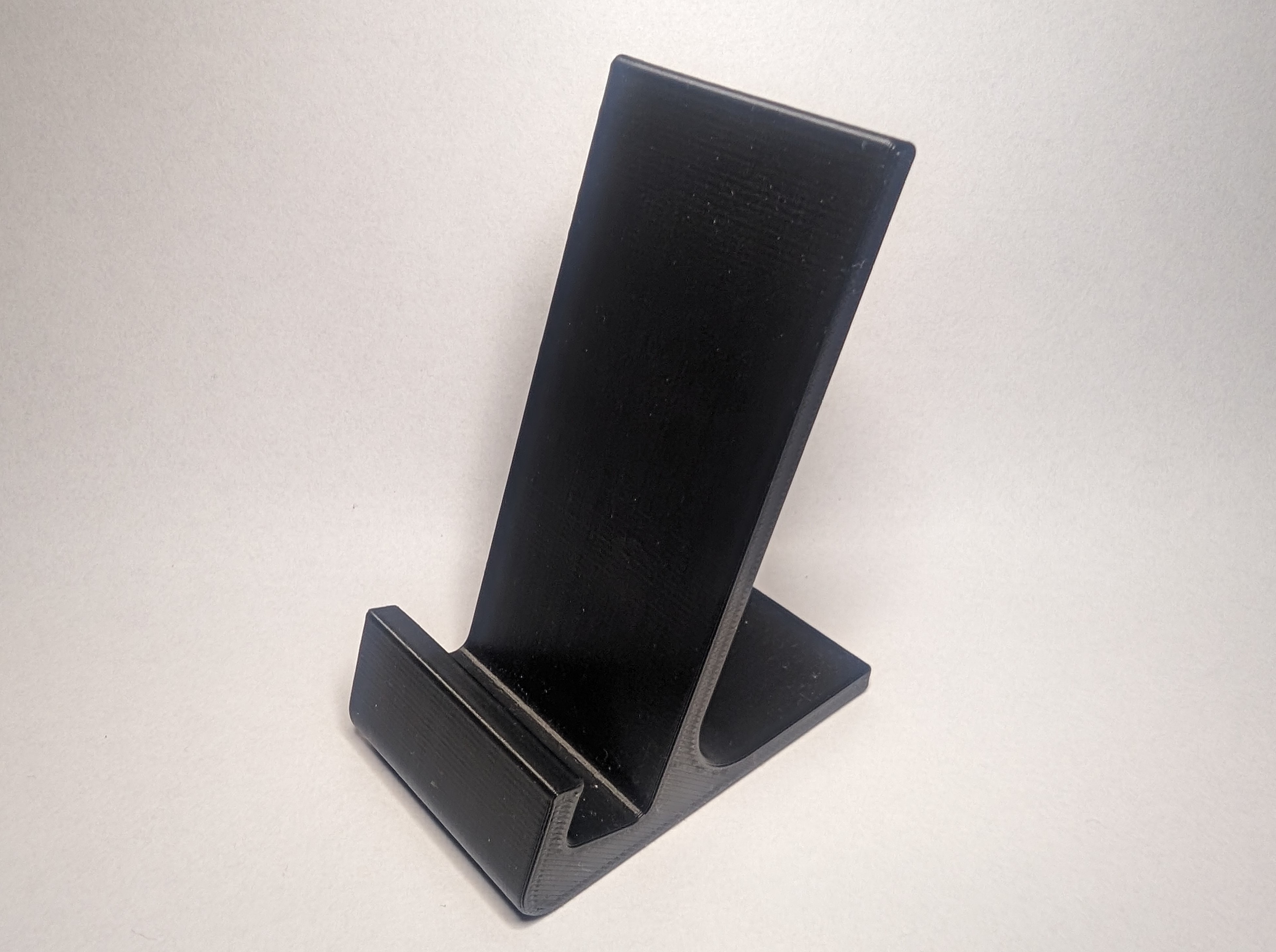 Phone stand for thick phones by Xermic | Download free STL model ...