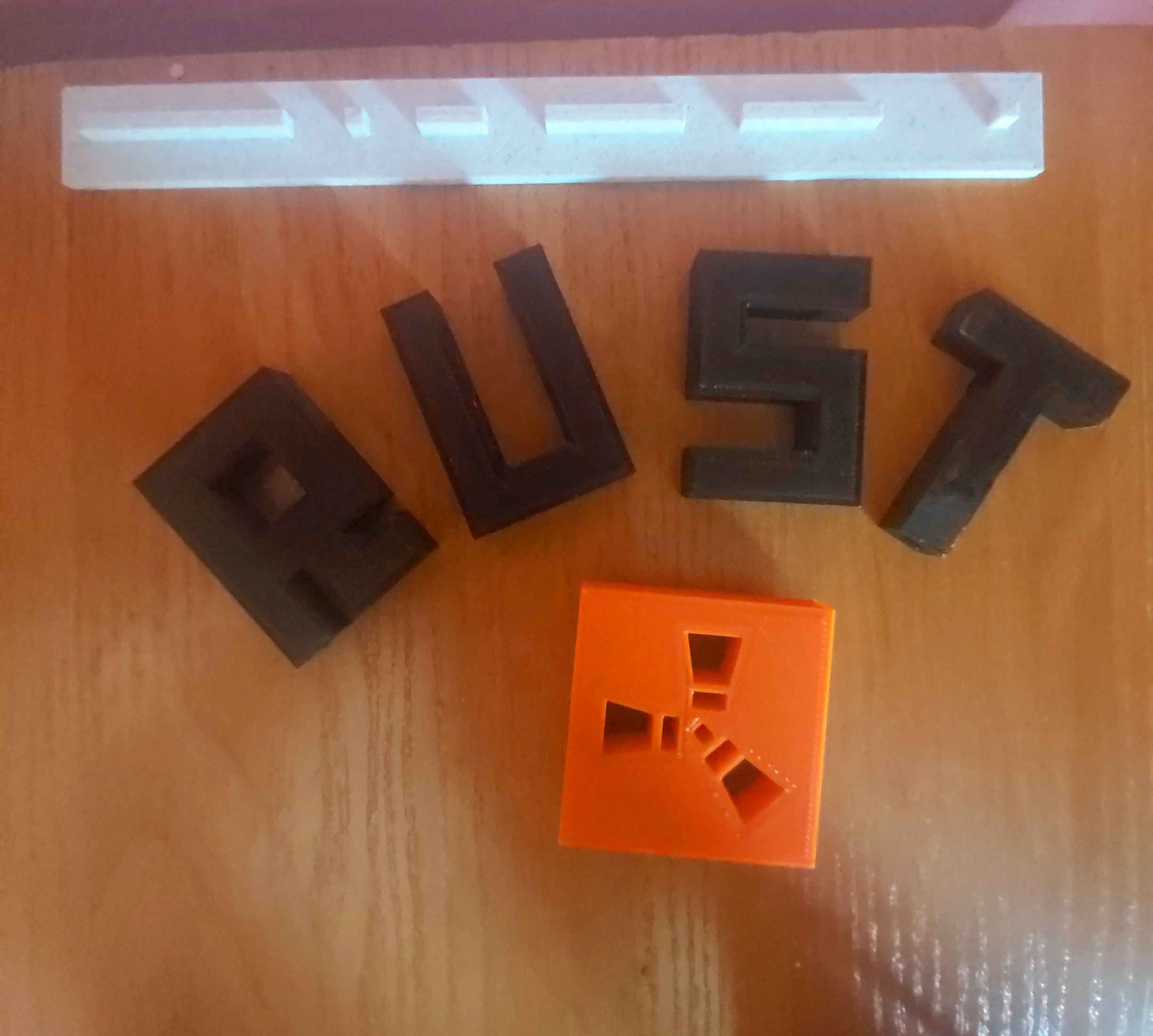 Rust logo on holder by Baaalzy | Download free STL model | Printables.com