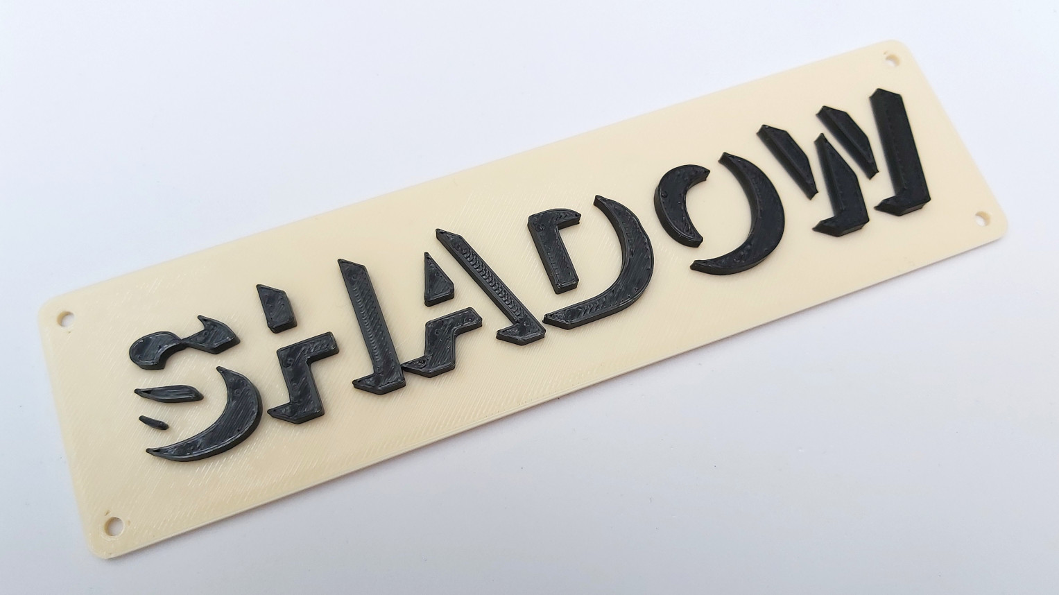Shadow Lettering (OpenSCAD) par Stone Age Sculptor | Téléchargez ...