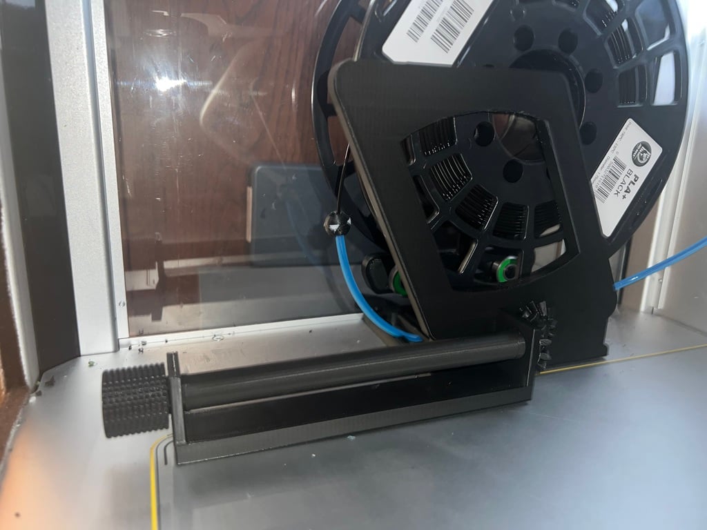Front load spool holder with right-angle gear drive for front panel ...
